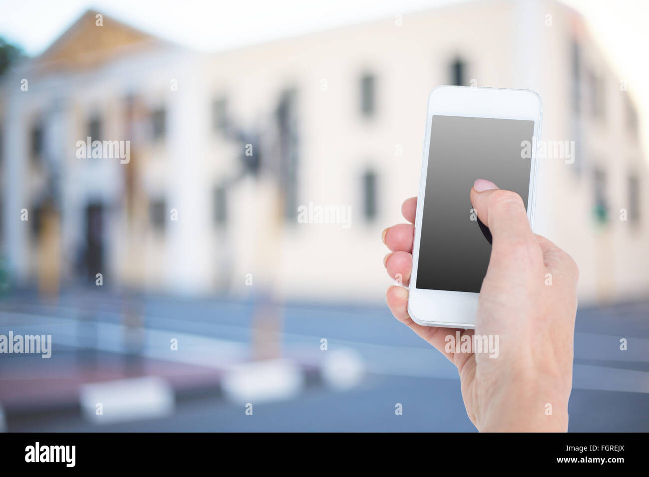 Composite image of hand showing smartphone Stock Photo - Alamy
