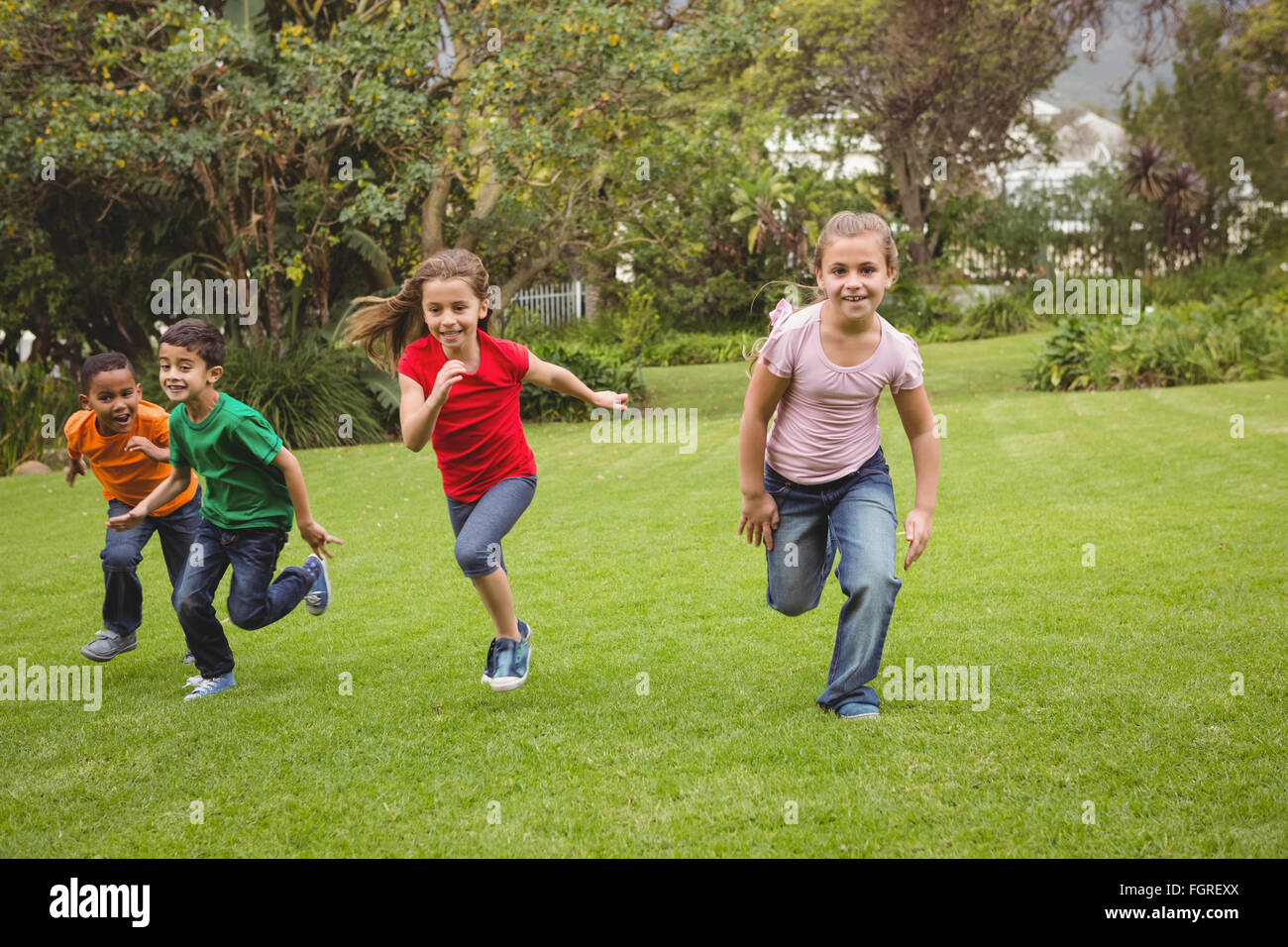 Boy running across grass hi-res stock photography and images - Alamy