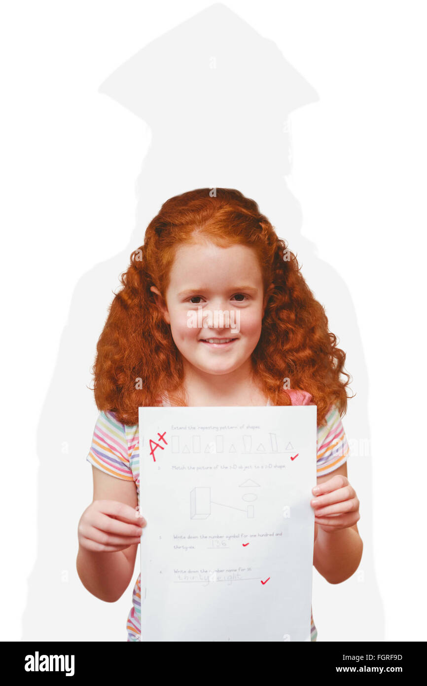 Composite image of pupil showing her a plus test Stock Photo - Alamy