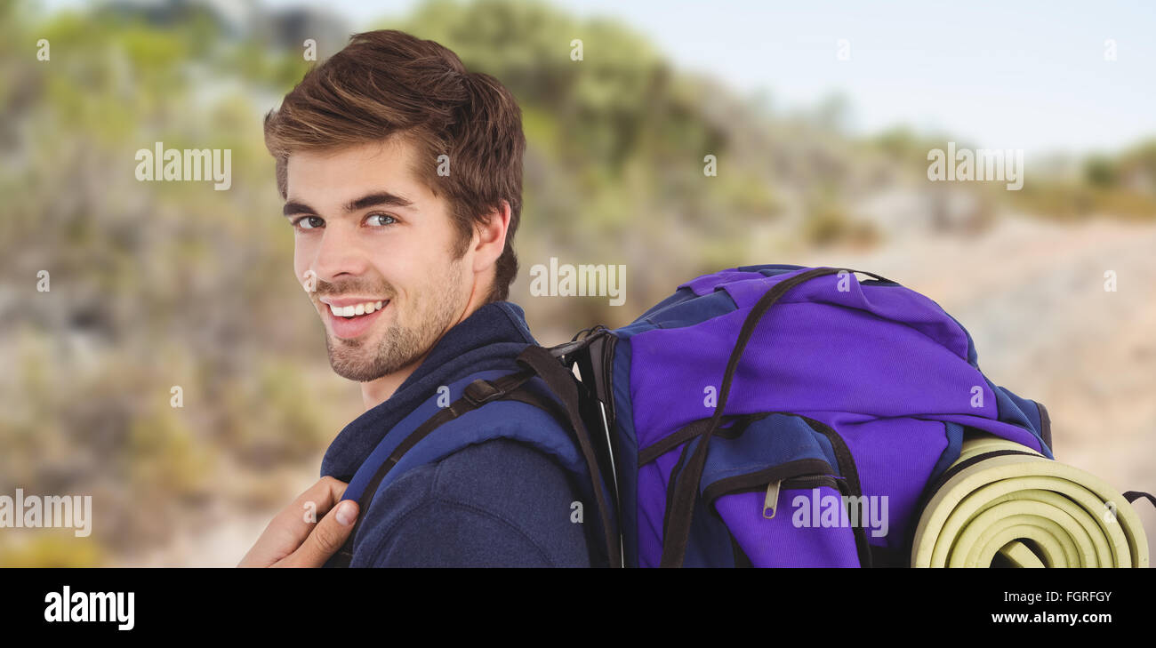 Composite image of side view of happy man with backpack Stock Photo - Alamy