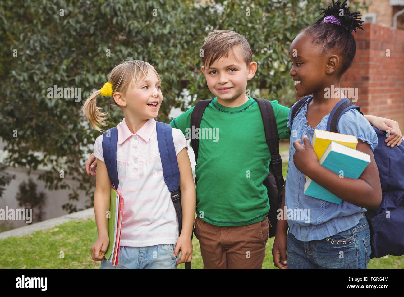 Smiling students looking at the camera Stock Photo - Alamy