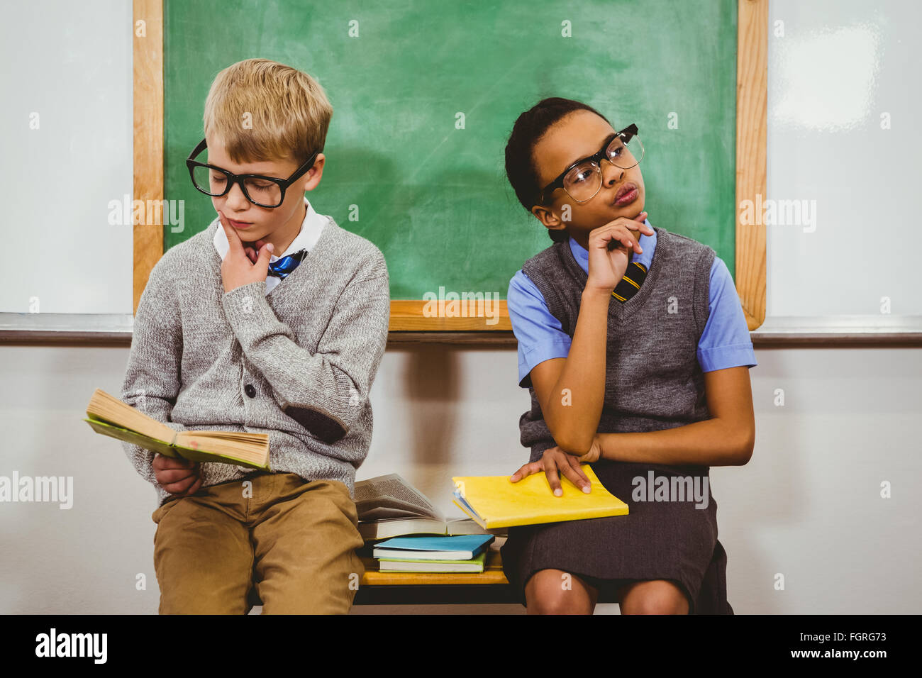 Curious students reading books in class Stock Photo - Alamy