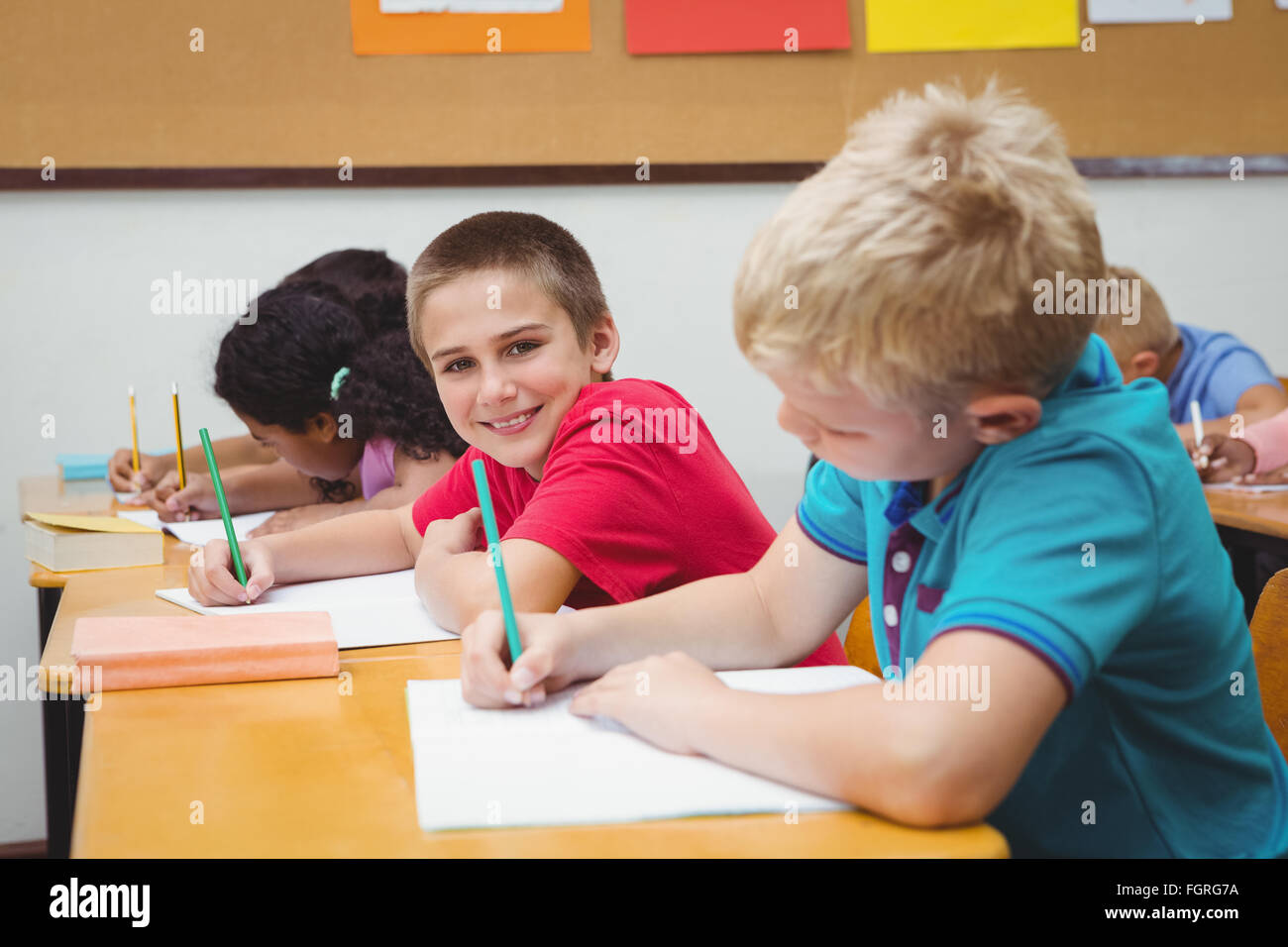 Pupils working at school work Stock Photo - Alamy