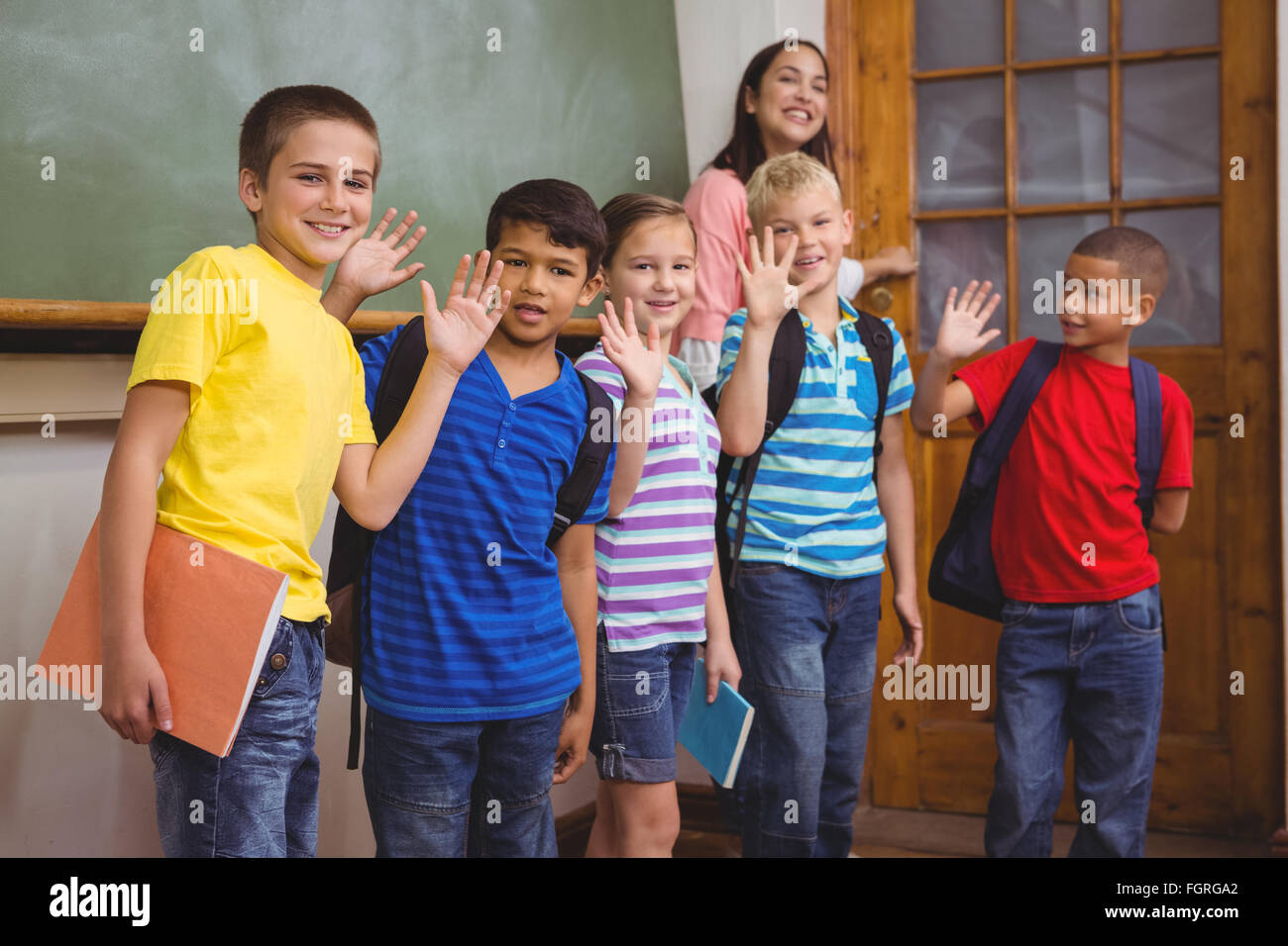 Students waving at teacher hi-res stock photography and images - Alamy