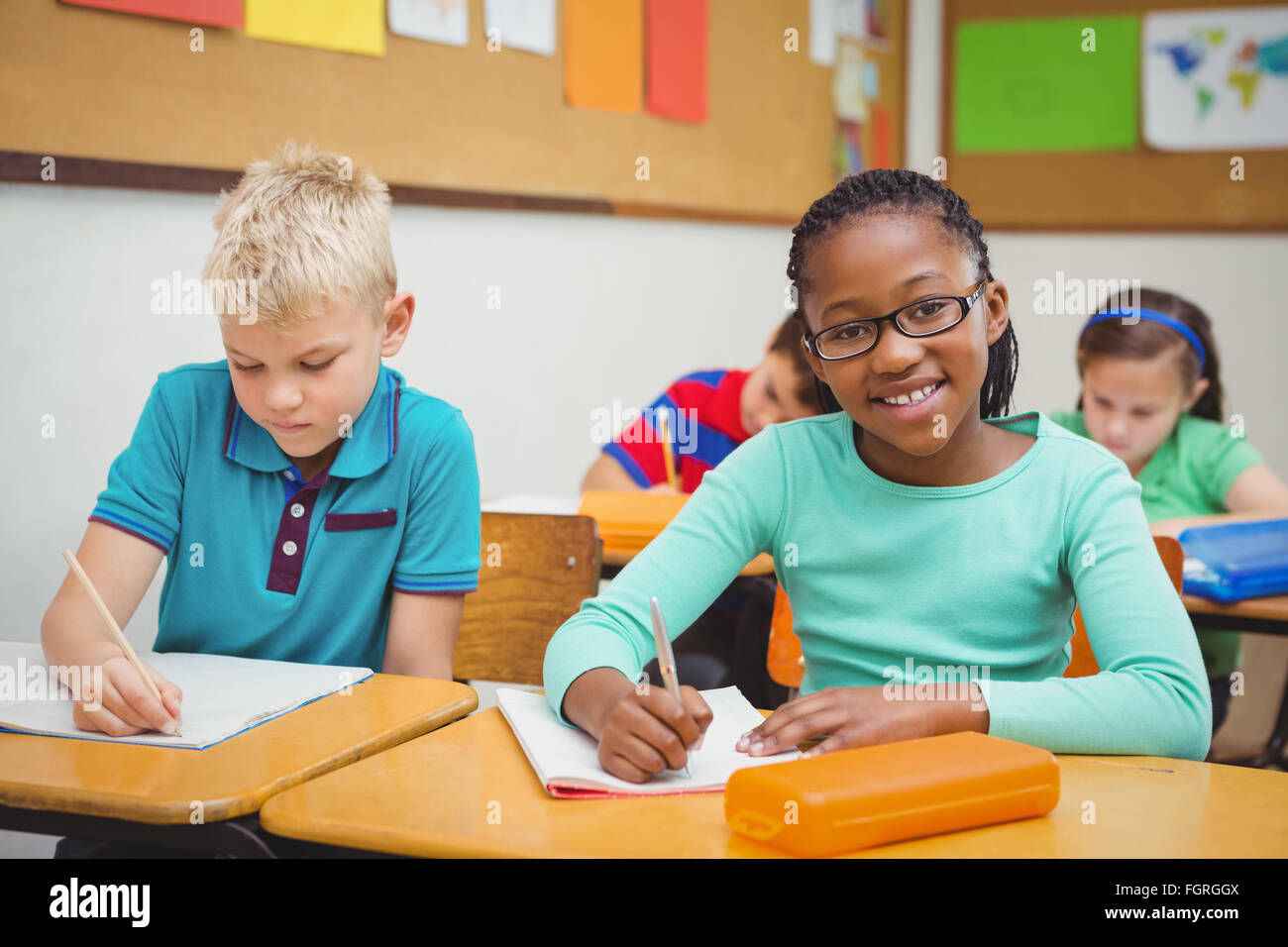 Happy student looking at the camera Stock Photo - Alamy