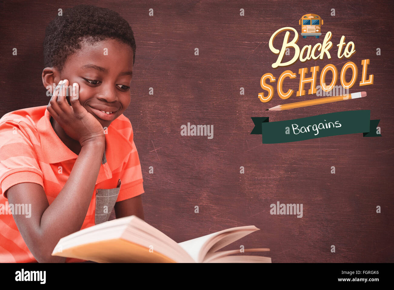 Composite image of cute boy reading book in library Stock Photo - Alamy