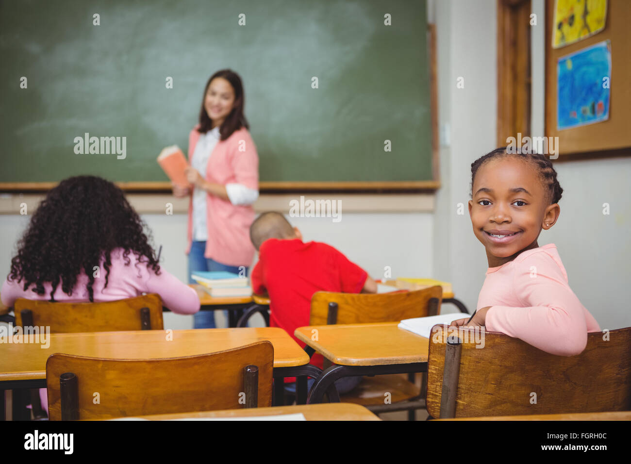 Student looking back at camera Stock Photo - Alamy