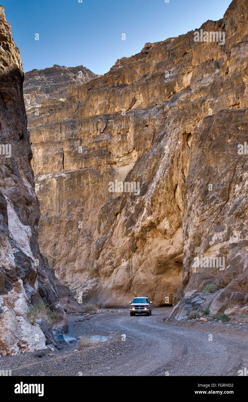 Car squeezing through the narrows of Titus Canyon in Grapevine ...
