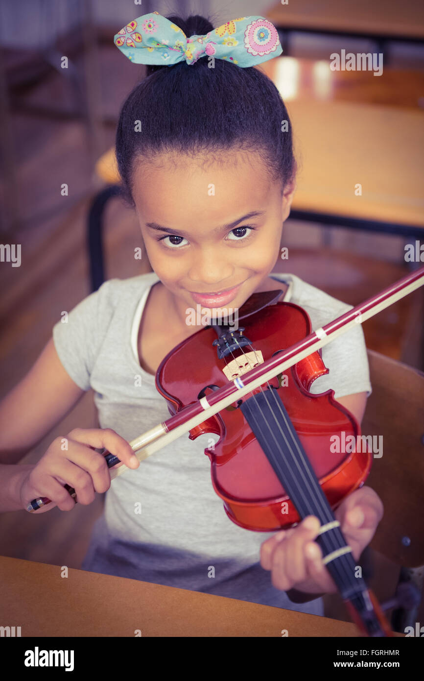 Student using a violin in class Stock Photo - Alamy