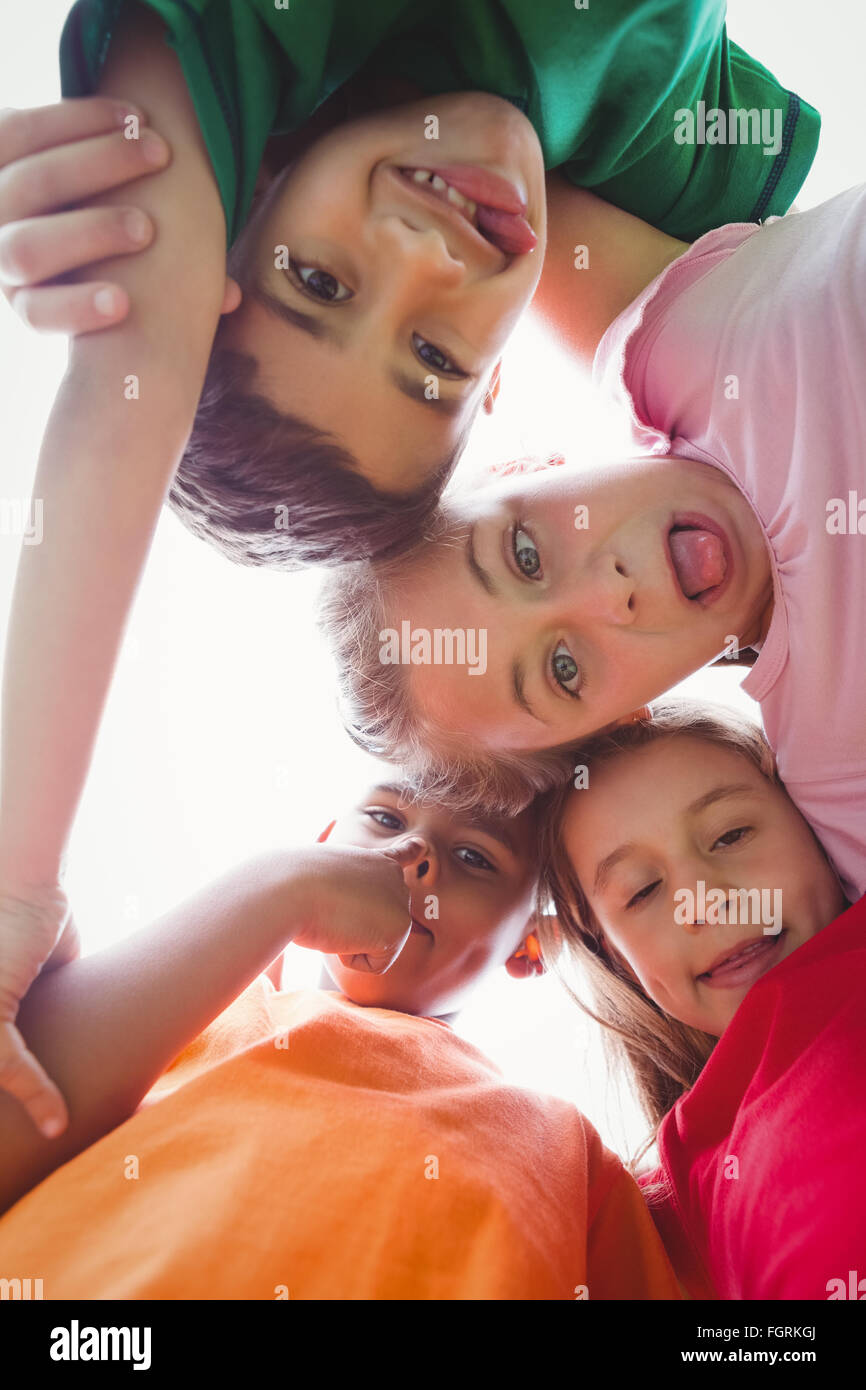 Smiling pupils looking down at the camera Stock Photo - Alamy