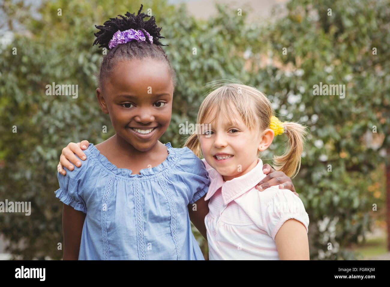 Smiling students looking at the camera Stock Photo - Alamy