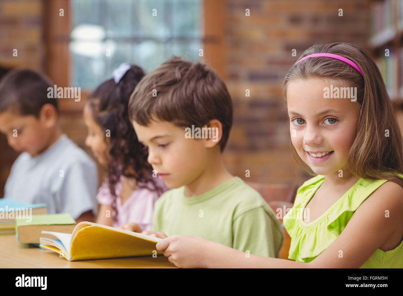 Pupils reading books in library hi-res stock photography and images - Alamy