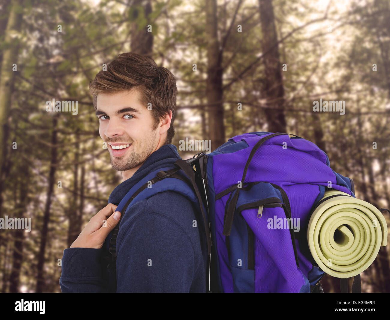 Composite image of side view of happy man with backpack Stock Photo - Alamy