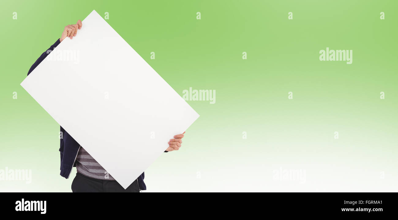 Composite image of man holding billboard in front of face Stock Photo ...