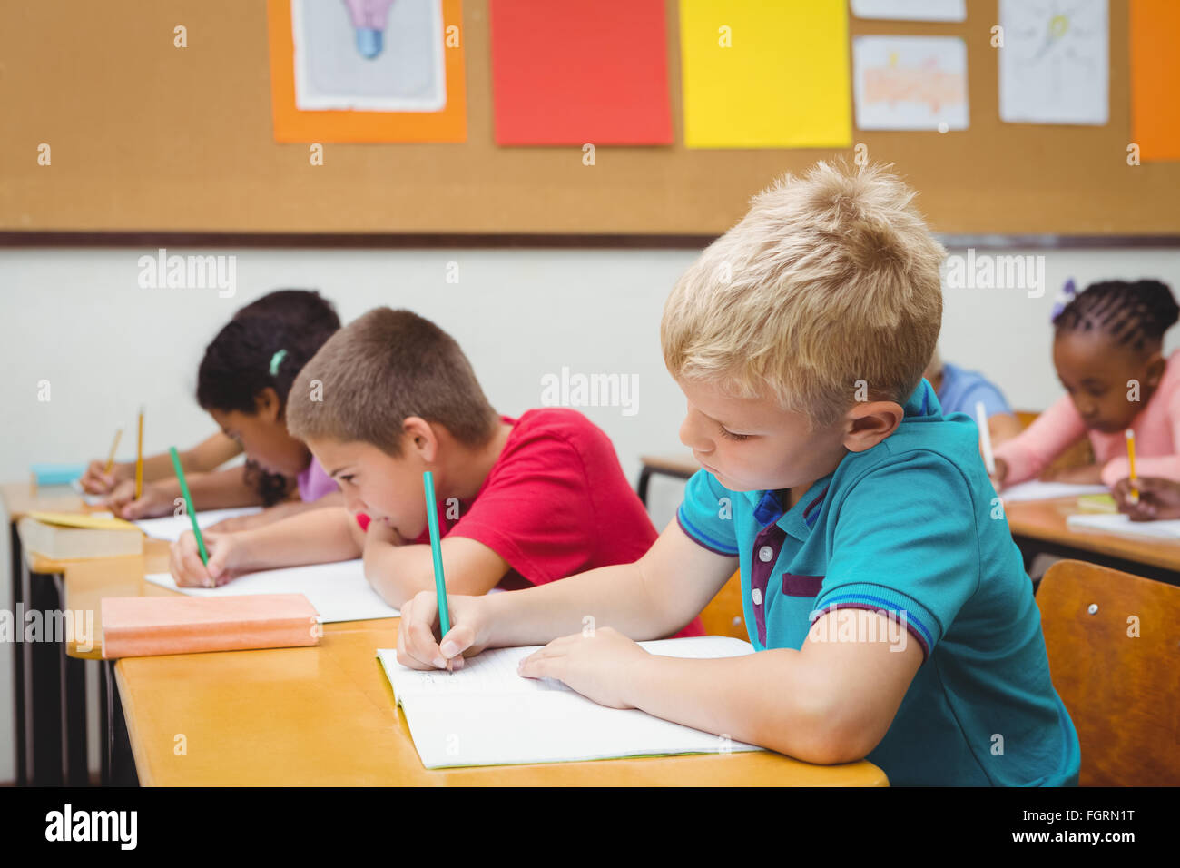Pupils working at school work Stock Photo - Alamy
