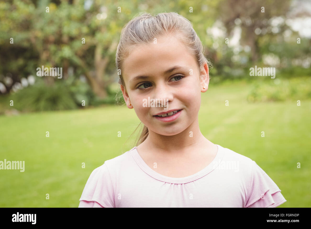 A Smiling kid standing outside Stock Photo - Alamy