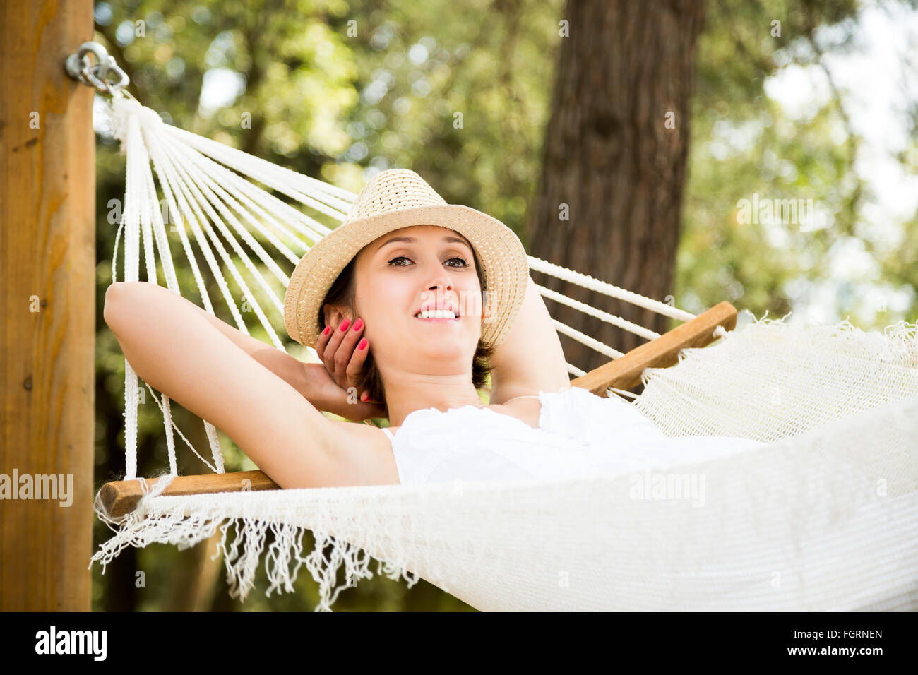 Young Woman Relaxing in a Hammock Stock Photo - Alamy