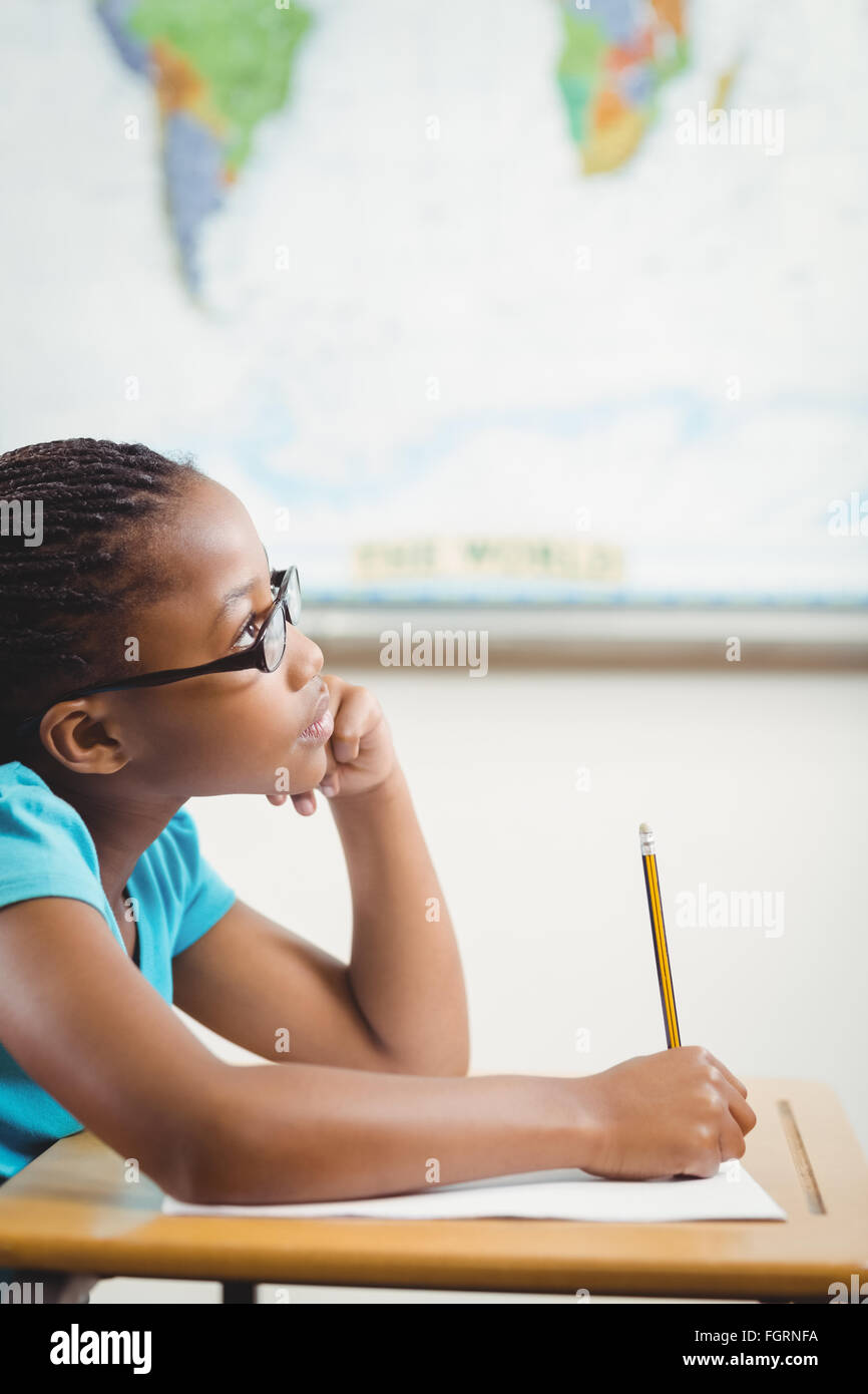 Focused pupil working at her desk in a classroom Stock Photo - Alamy