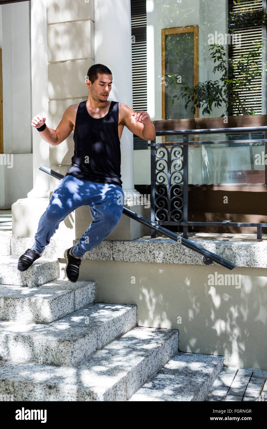 Extreme athlete doing a slide Stock Photo - Alamy