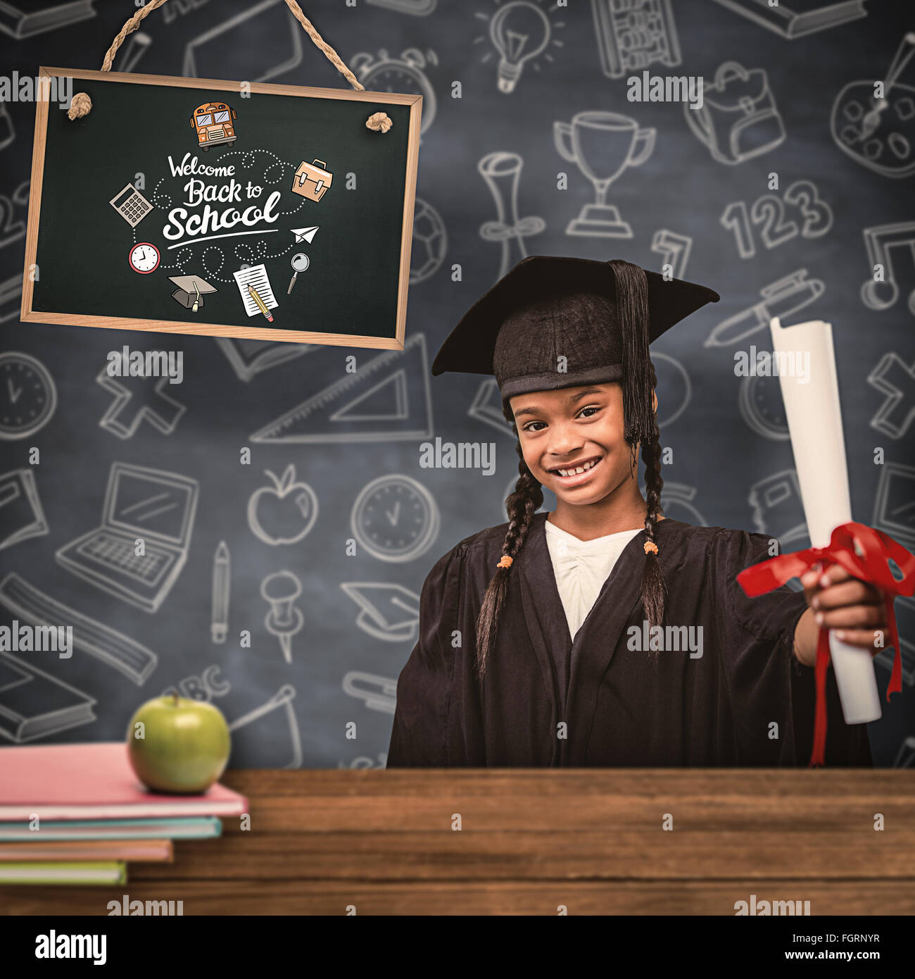 Composite image of cute pupil in graduation robe Stock Photo - Alamy
