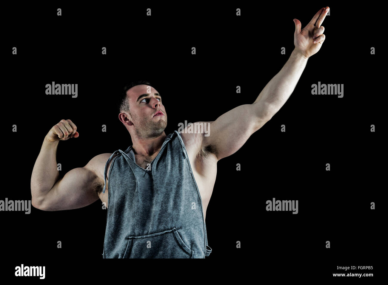 Handsome bodybuilder posing with arms up Stock Photo - Alamy