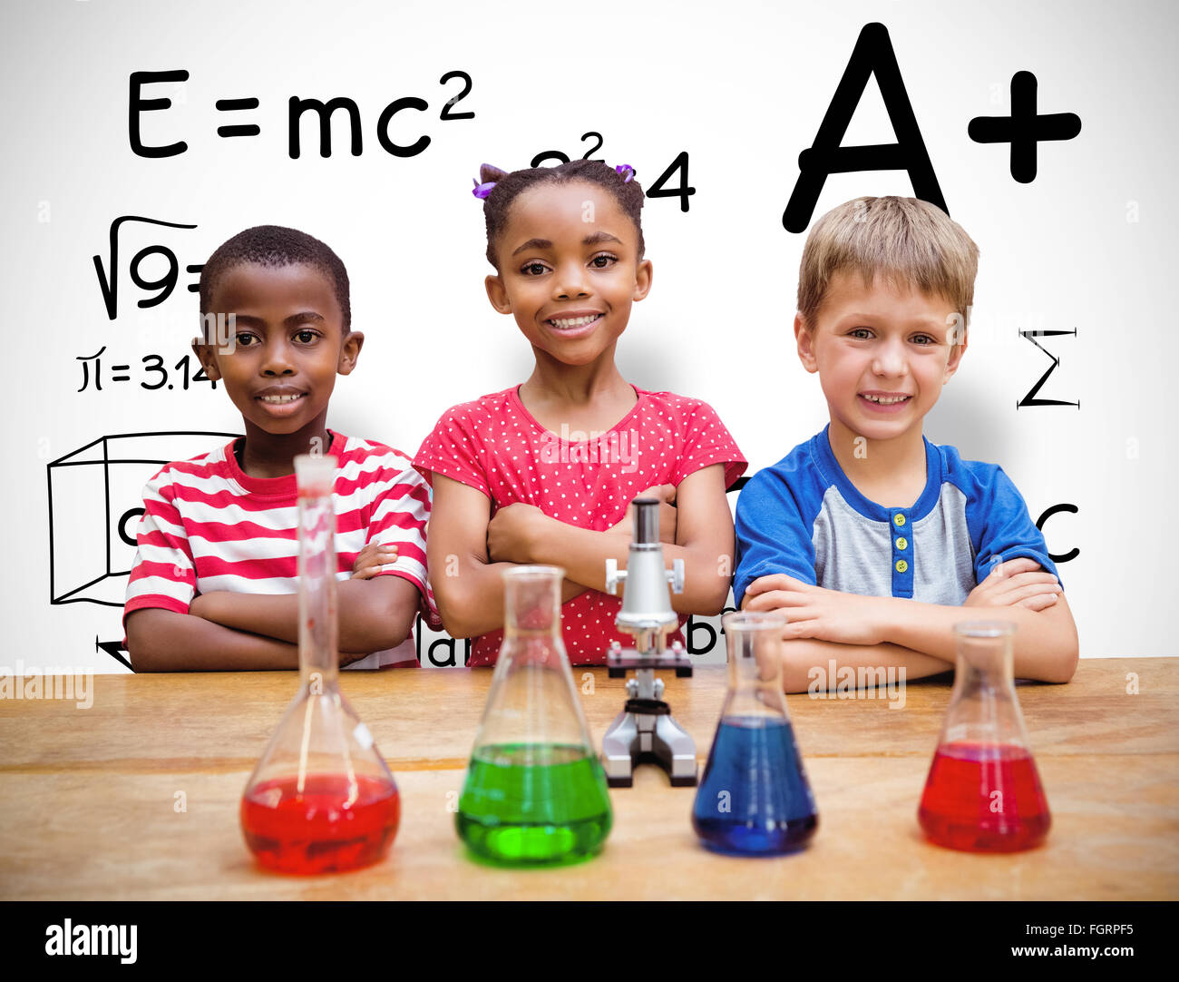 Composite image of cute pupils standing with arms crossed behind beaker ...