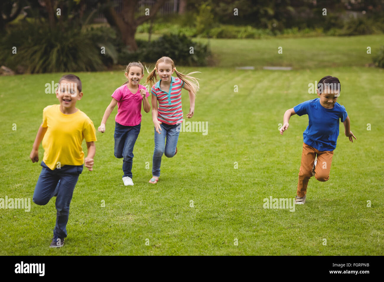 Cute pupils running towards camera Stock Photo - Alamy