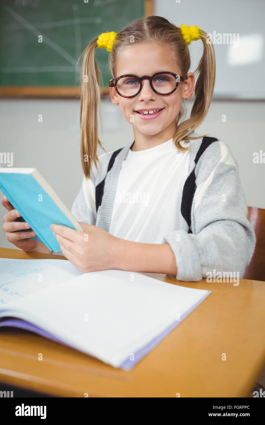 Smiling girl pigtails reading hi-res stock photography and images - Alamy