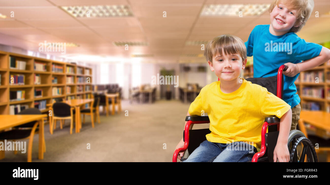 Composite image of happy boy pushing friend on wheelchair Stock Photo ...