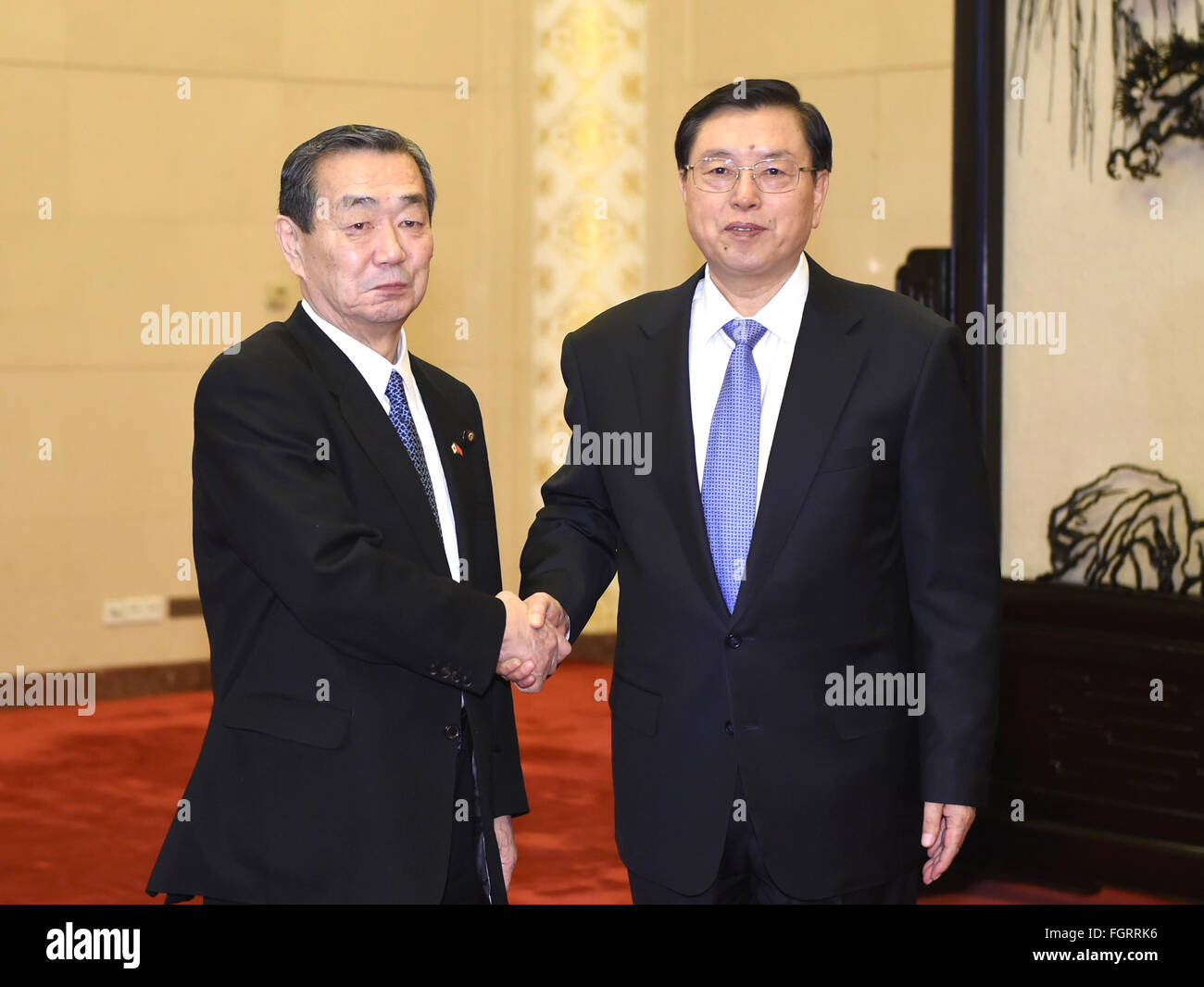 Beijing, China. 22nd Feb, 2016. Zhang Dejiang (R), chairman of the ...
