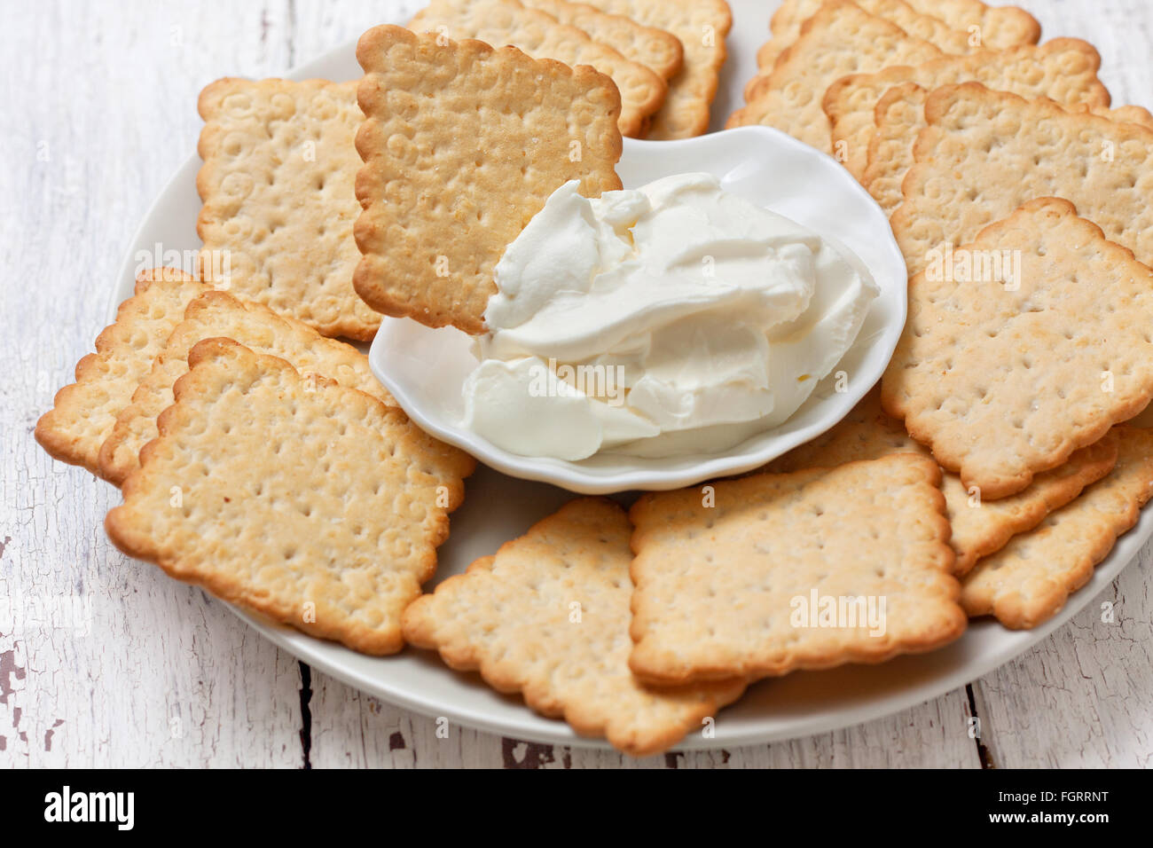 light snack of crackers and cream cheese on blue napkin on Stock Photo ...