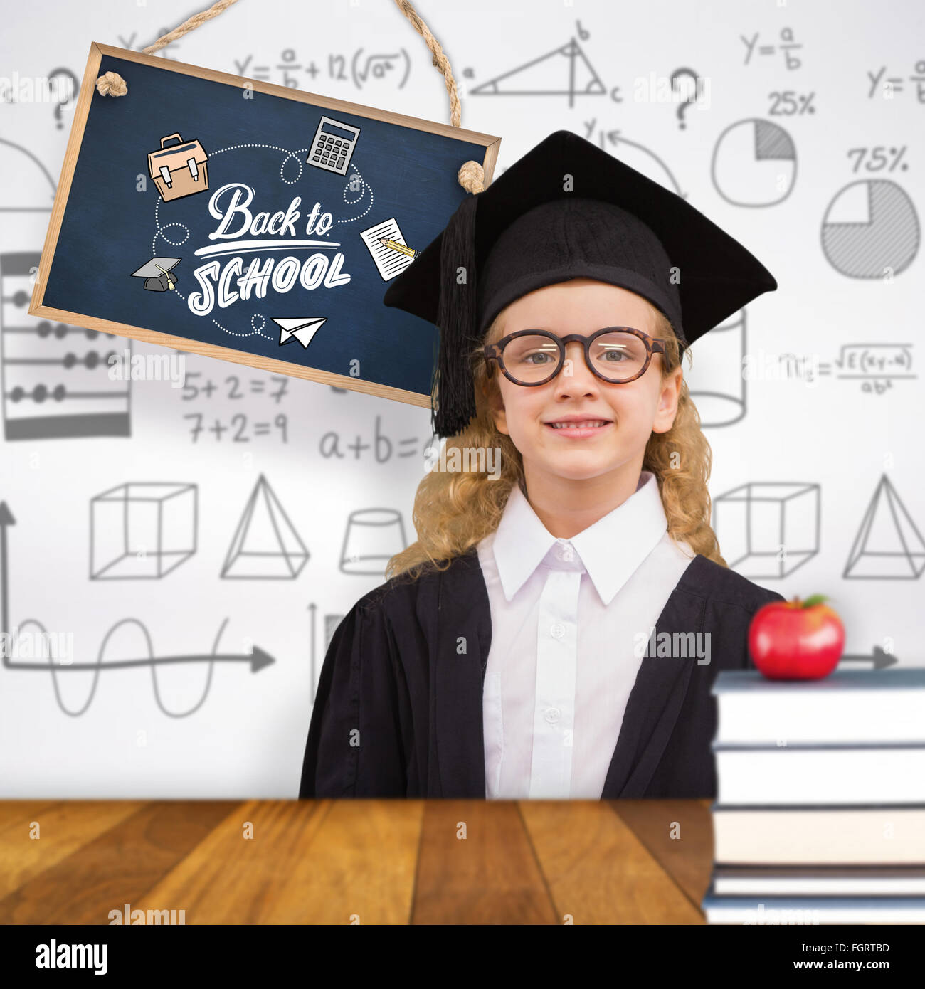 Composite image of cute pupil in graduation robe Stock Photo - Alamy