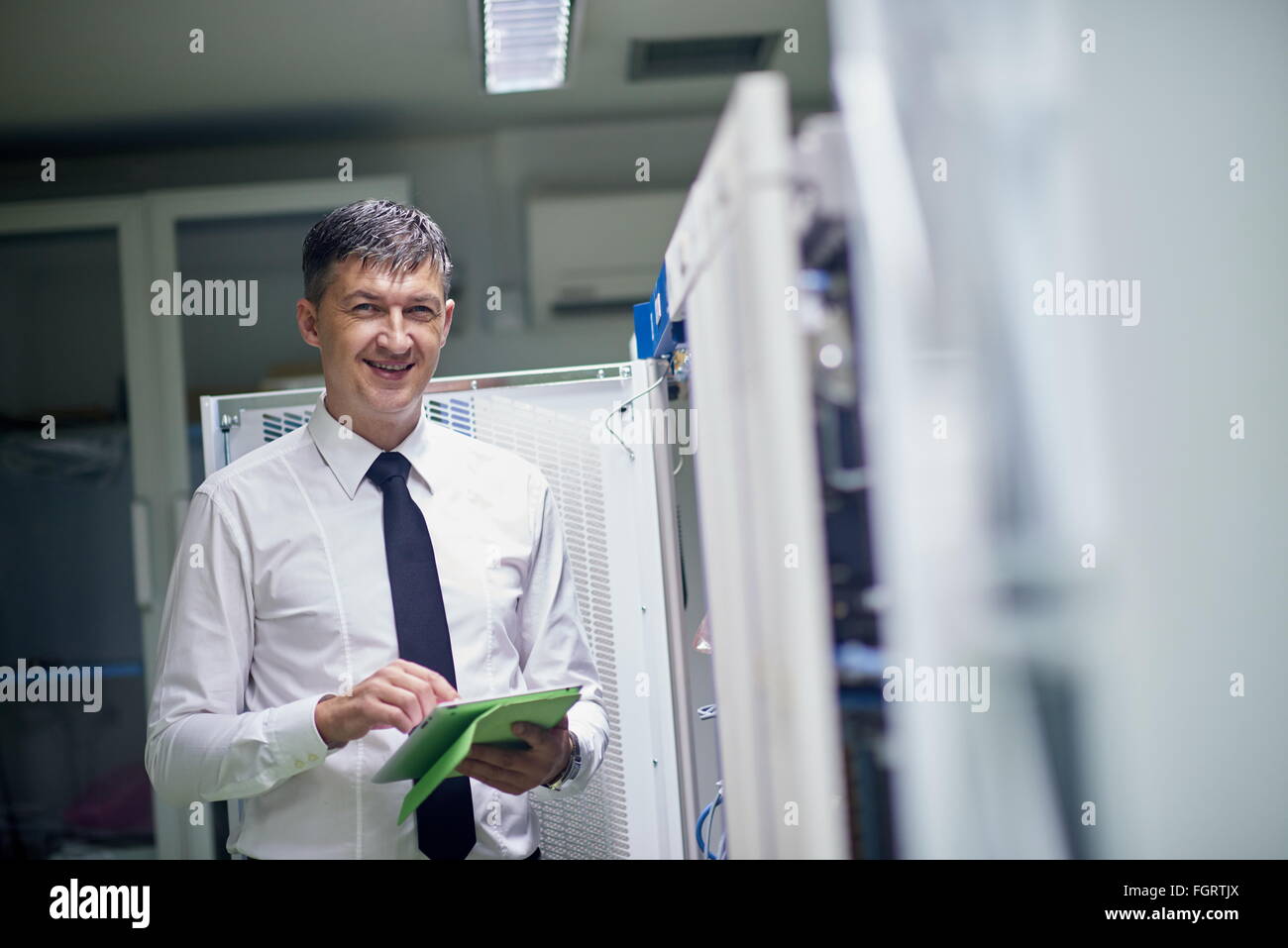 network engineer working in server room Stock Photo - Alamy