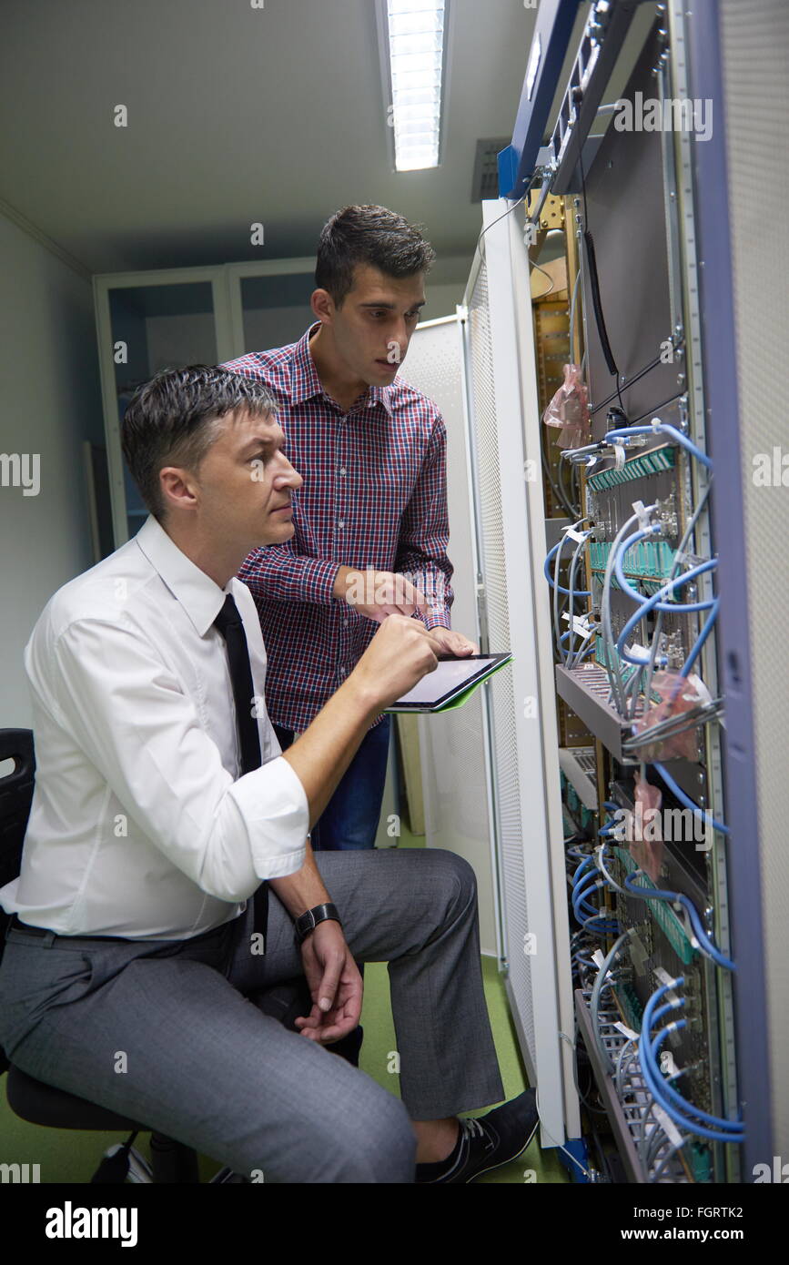 network engineers in server room Stock Photo - Alamy