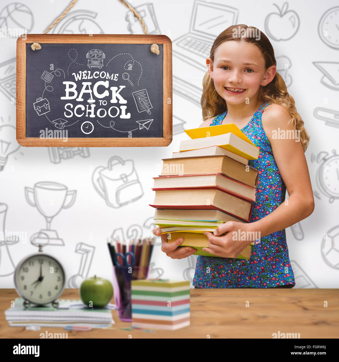 Composite image of cute little girl carrying books in library Stock ...
