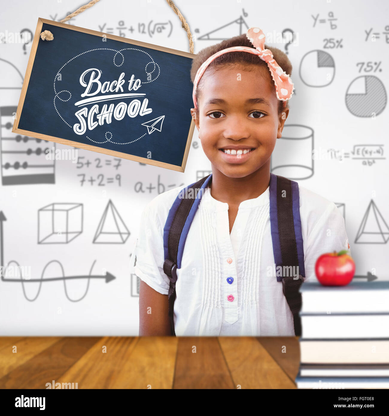 Composite image of little girl smiling in school corridor Stock Photo ...