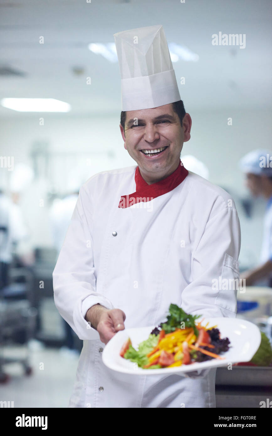 chef in hotel kitchen preparing and decorating food Stock Photo - Alamy