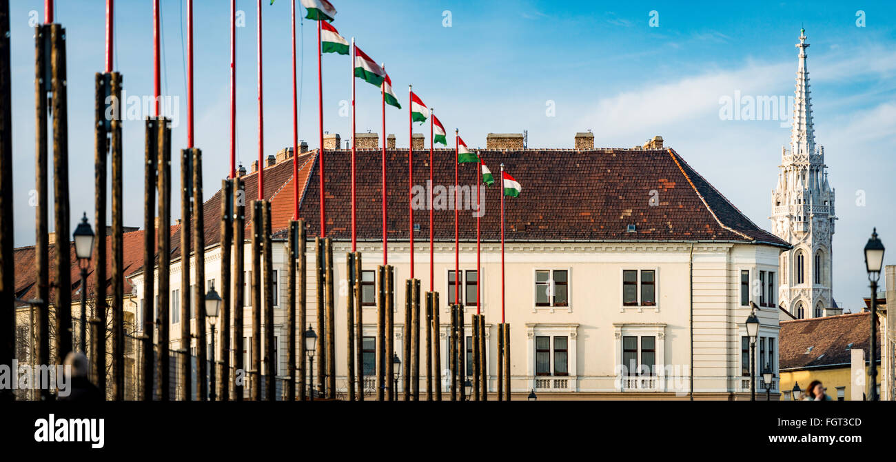 Row of hungarian national flags on Buda castle hill. Budapest city, Hungary, Europe. Blue cloudy ...