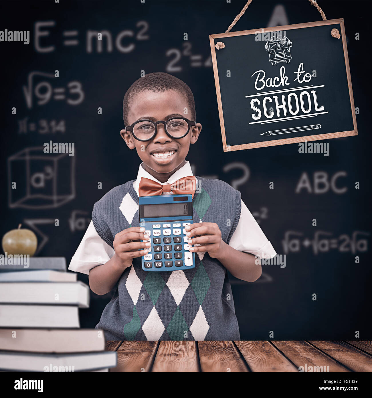 Composite image of happy pupil with calculator Stock Photo - Alamy