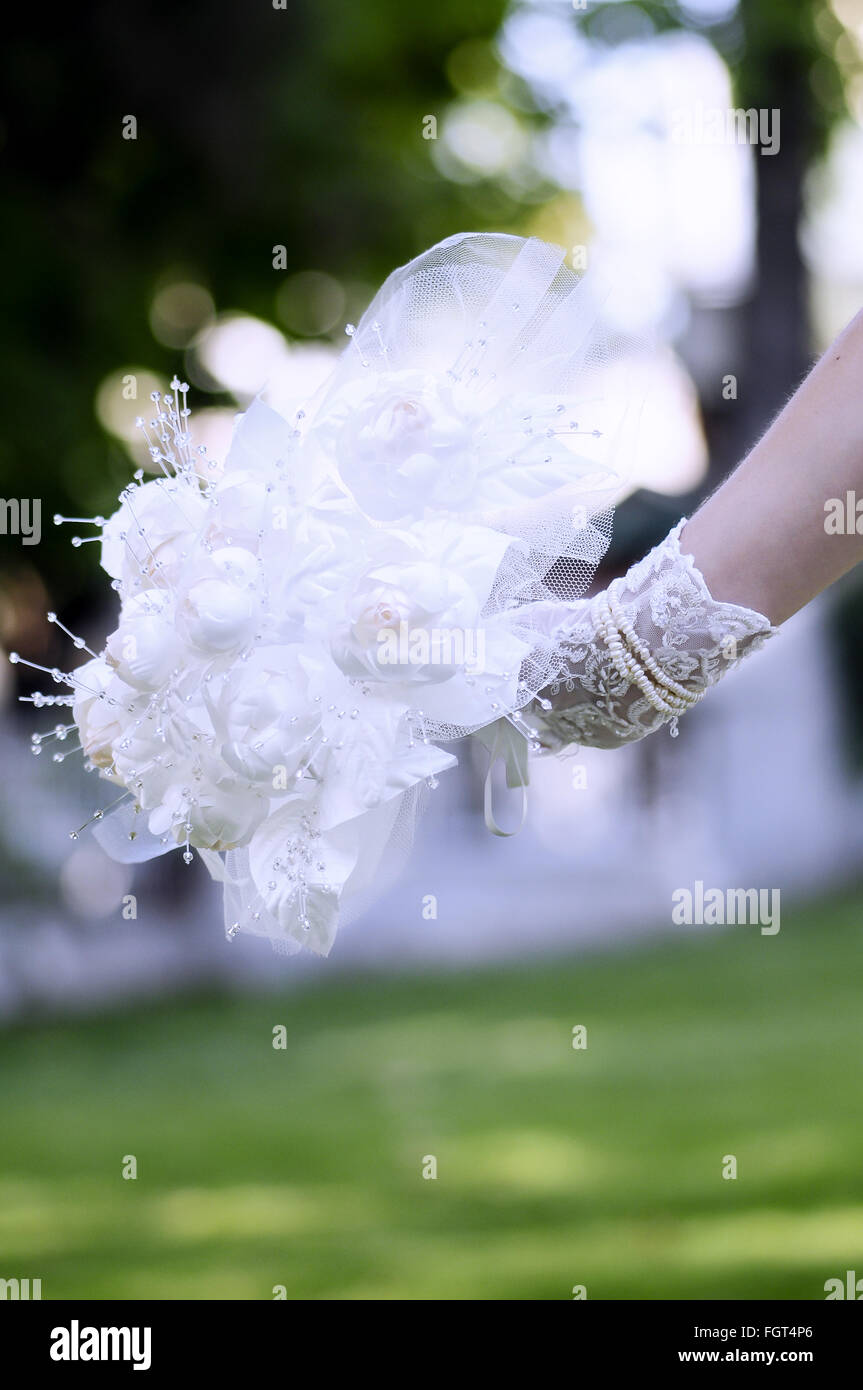 Bride hold lace rose bouquet her hand on breen background Stock Photo ...