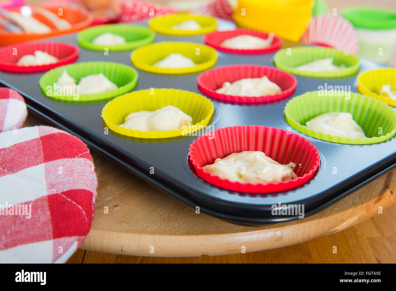 Baking cupcakes with metal form and paper models Stock Photo - Alamy