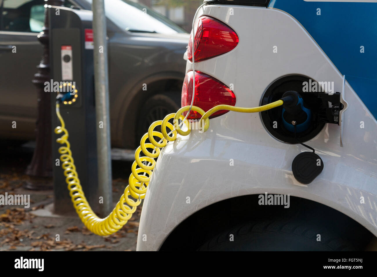 EV / Electric car / electrically powered cars being charged / having ...