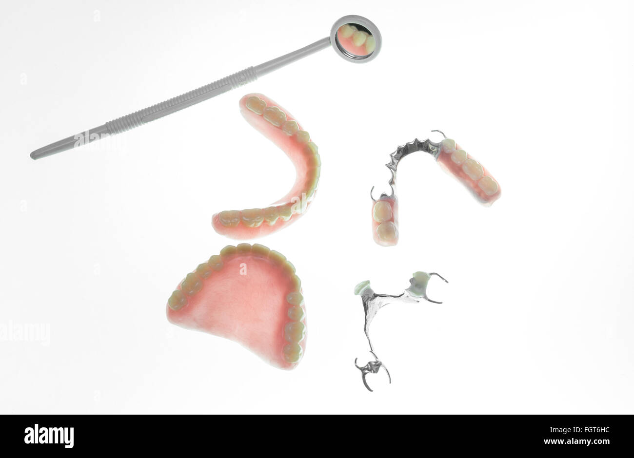 denture and dental mirror isolate on white background Stock Photo - Alamy