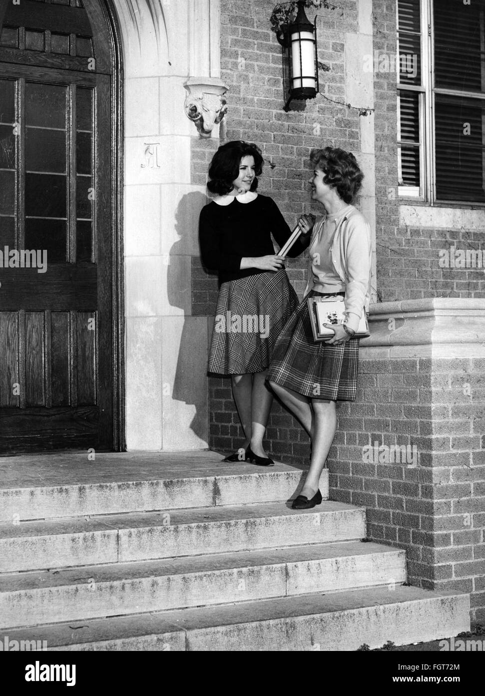 pedagogy, students, two students with books, campus of a university in ...