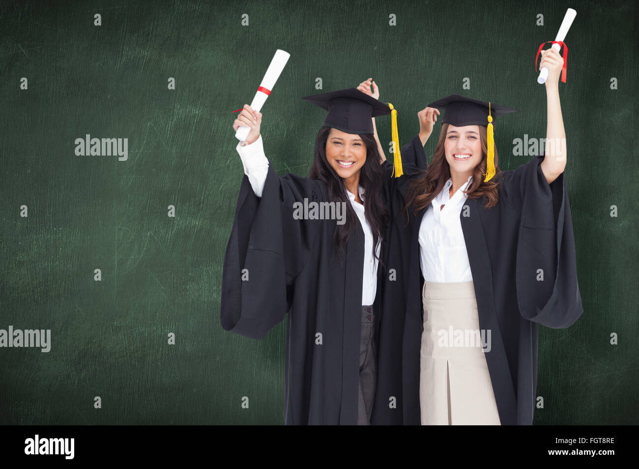 Composite image of two women celebrating their graduation Stock Photo ...
