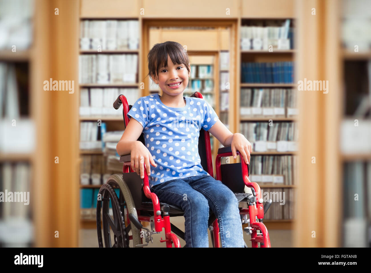 Composite image of cute disabled pupil smiling at camera in hall Stock ...