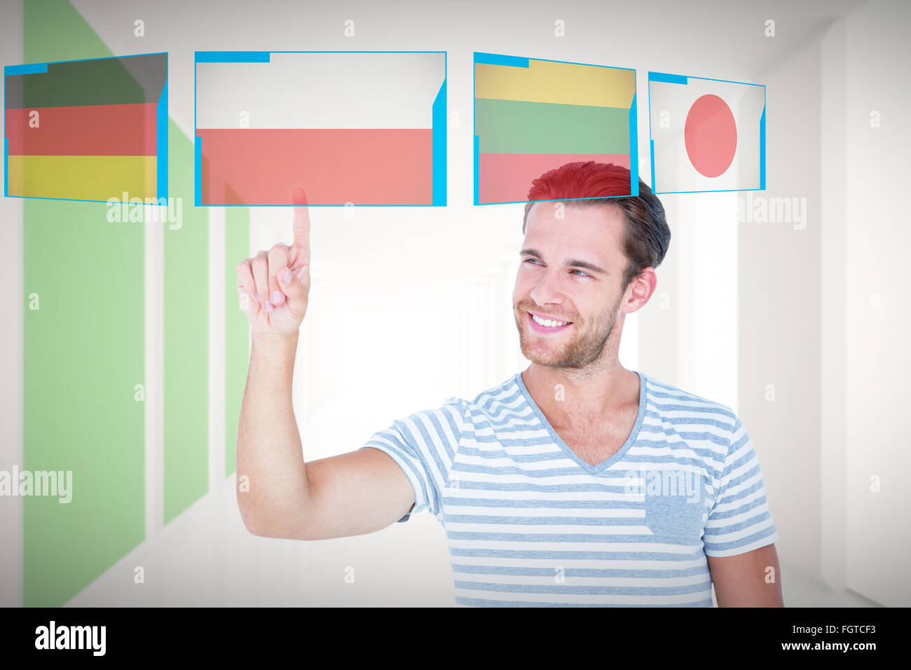 Composite image of handsome man pointing at something Stock Photo - Alamy