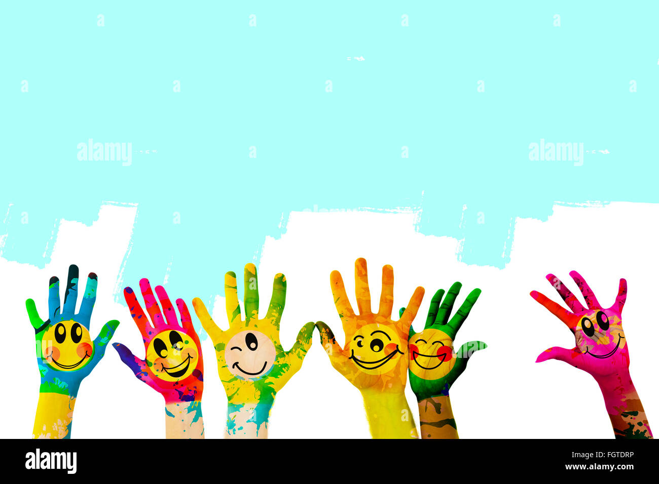 Composite image of hands with colourful smiley faces Stock Photo - Alamy