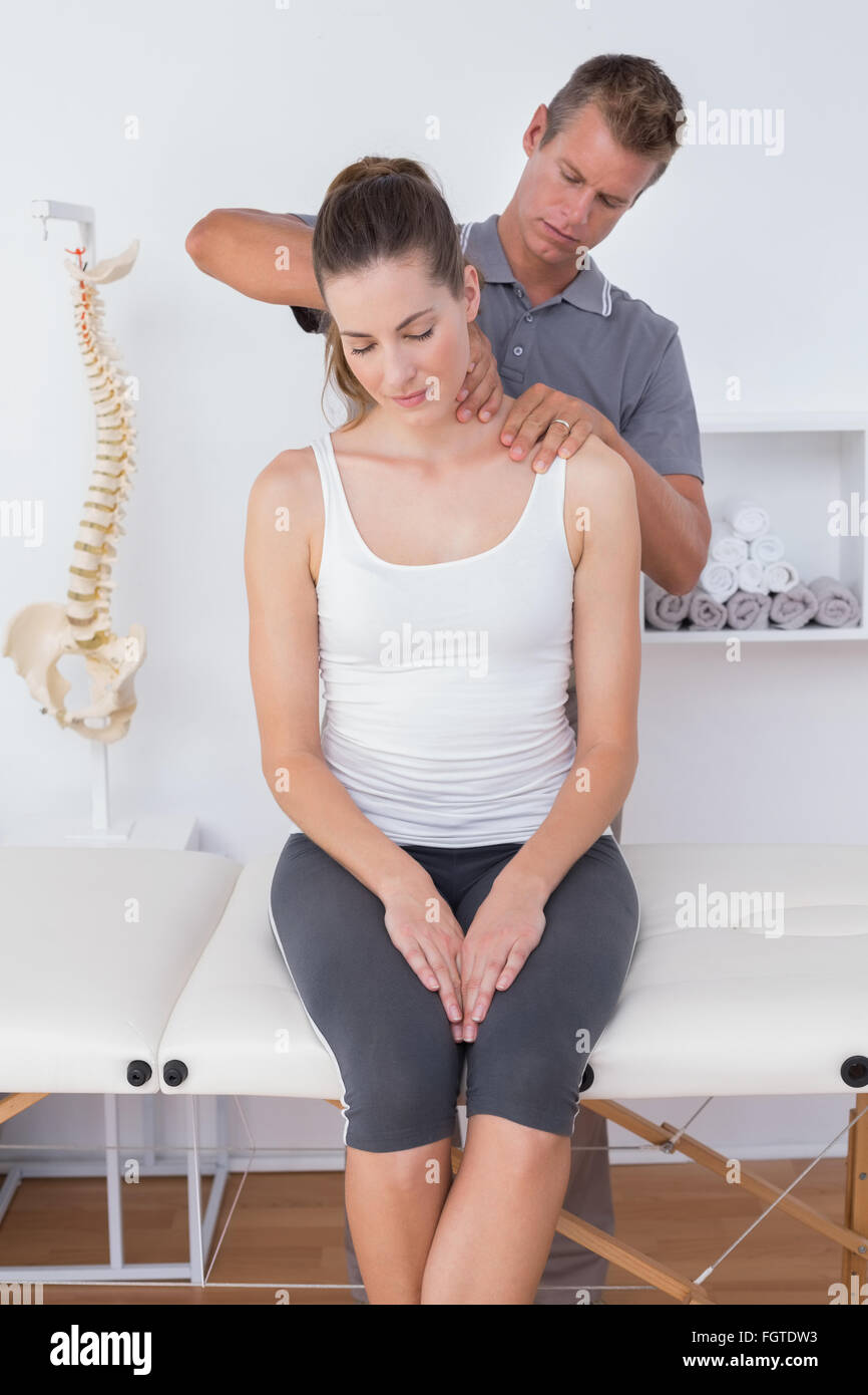 Doctor doing neck adjustment Stock Photo - Alamy