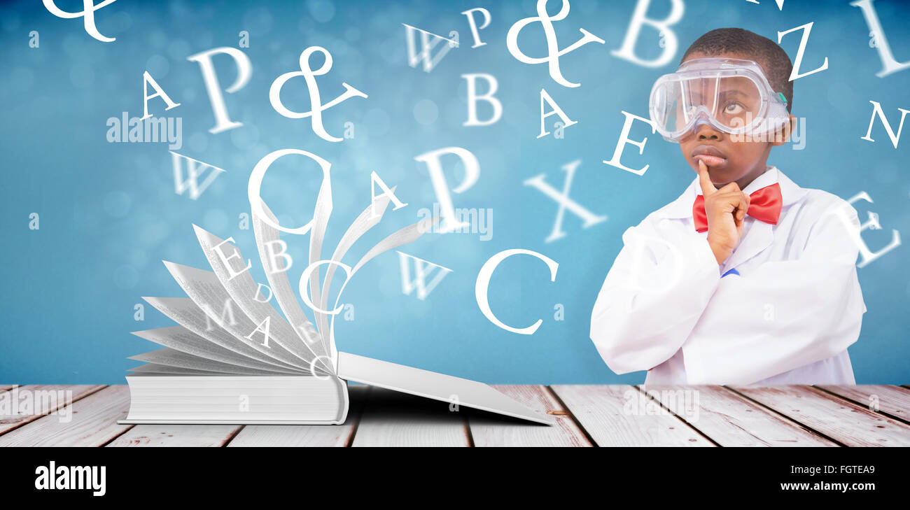 Composite image of cute pupil dressed up as scientist Stock Photo - Alamy